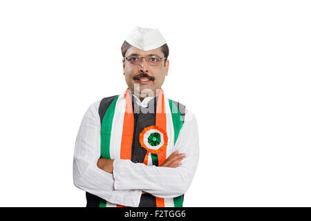 Politician standing with arms crossed and smiling Stock Photo - Alamy