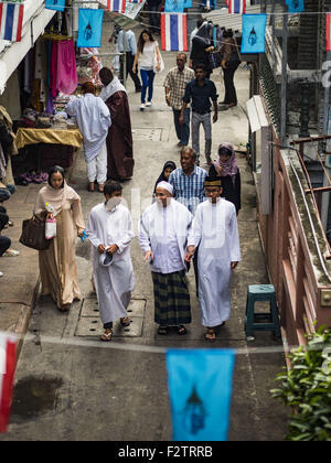 Bangkok, Thailand. 24th Sep, 2015. Girls relax in front of Haroon ...