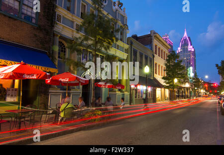 Mobile Alabama downtown traffic on Dauphin Street at twilight with ...