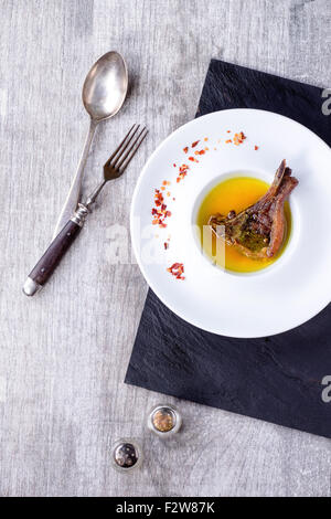 Well done grilled lamb chop Stock Photo - Alamy