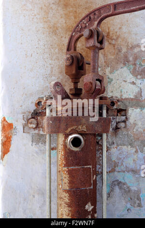 Old and rusty manual water pump Stock Photo - Alamy