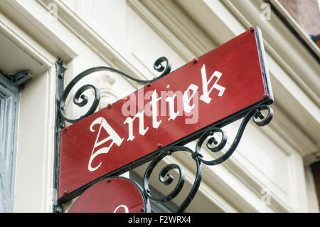 Wrought iron sign for antiques shop in Borro, Tuscany Stock Photo - Alamy