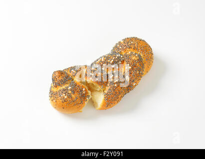 Braided bread roll topped with poppy seeds and salt Stock Photo - Alamy