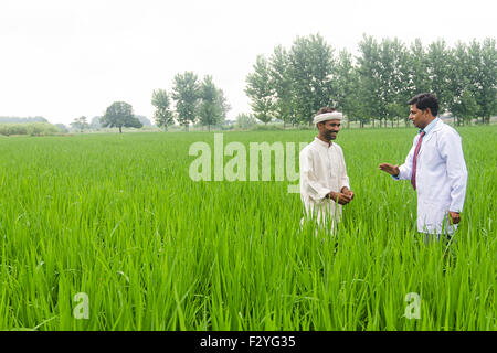 2 indian Doctor and rural farmer Farm Mobile Phone Quality showing ...