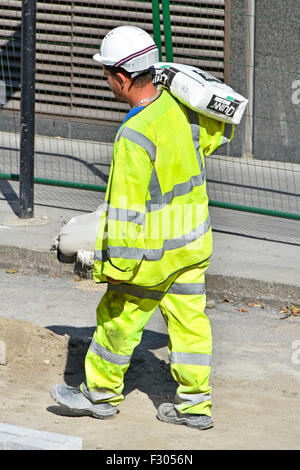 Worker carrying heavy cement bag in Kolkata , India Stock Photo - Alamy