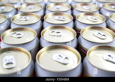Many metallic beer cans on texture background of fashion pastel lime ...