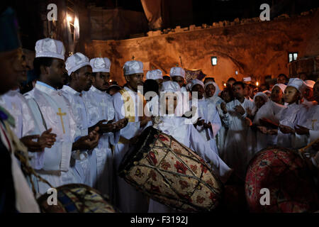 Ethiopian Orthodox Christians play the Kebero a double-headed, conical ...