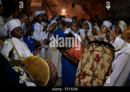Ethiopian Orthodox Christians play the Kebero a double-headed, conical ...
