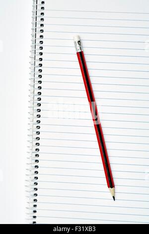 Spiral notebook with pencil and eraser Stock Photo - Alamy