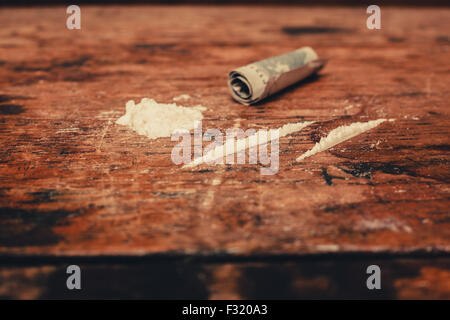 Cocaine and banknote arranged on table Stock Photo - Alamy