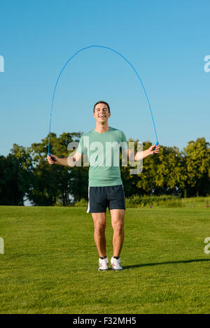 The athlete jumps on a skipping rope in the gym opposite the boxing ...