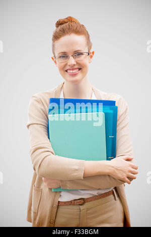 Digital composite of Student holding files and bag Stock Photo - Alamy