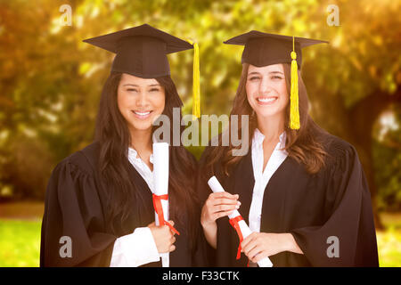 Composite image of two friends stand together after graduating Stock ...
