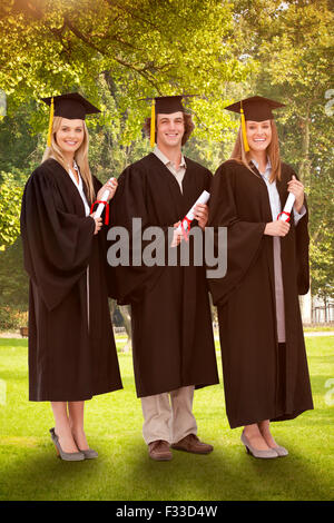 Composite image of smiling students in computer class Stock Photo - Alamy