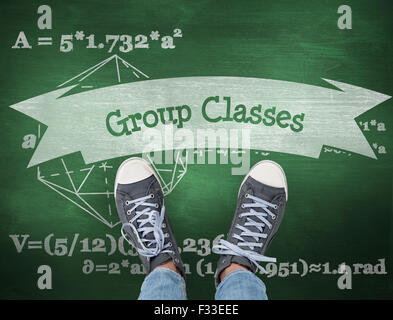 Group classes against green chalkboard Stock Photo - Alamy