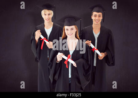 Composite image of group of teenagers celebrating after graduation ...
