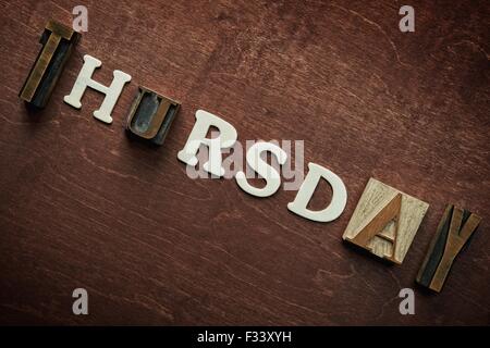 Thursday word written with vintage wooden cubes and black letters ...