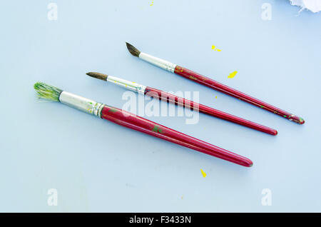 A set of three dirty paintbrushes isolated Stock Photo - Alamy