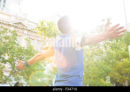 Carefree athlete with arms outstretched Stock Photo - Alamy