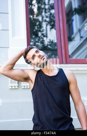 Handsome athlete stretching his head Stock Photo - Alamy