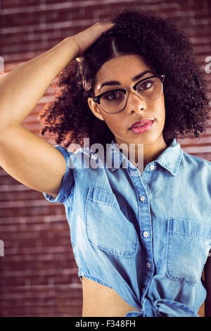 Attractive hipster holding hair back Stock Photo - Alamy