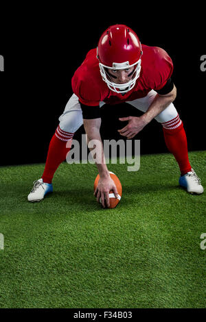 American football player starting football game Stock Photo - Alamy