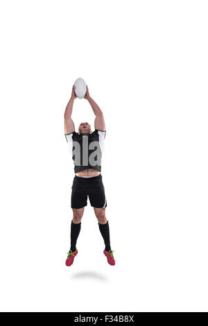 Rugby player catching ball Stock Photo - Alamy