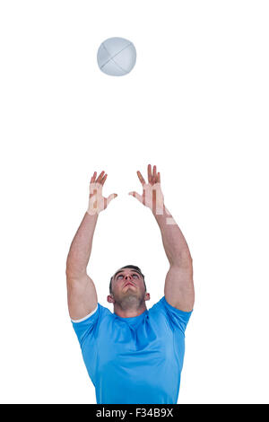 Rugby player catching ball Stock Photo - Alamy