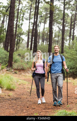 Young happy hiker couple hiking Stock Photo - Alamy