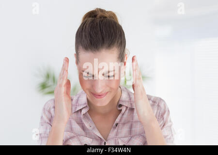 Female Patient With Headache In A Clinic Stock Photo - Alamy