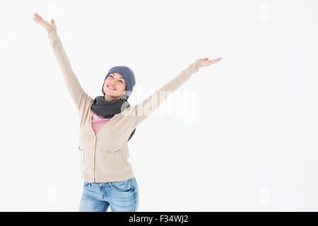 Smiling brunette standing arms open Stock Photo - Alamy
