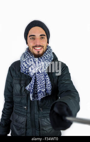 Young hispanic man with beard using computer laptop at night at home ...