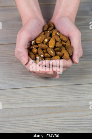 HANDFUL OF ALMONDS Stock Photo - Alamy