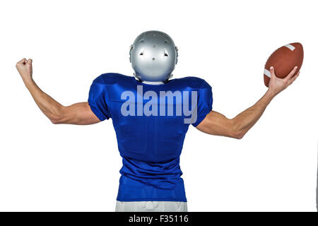 American football player flexing his muscles Stock Photo - Alamy