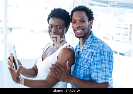 Portrait of a husband and wife smiling while looking into each other's ...