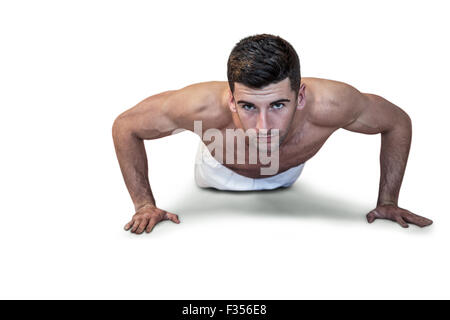 Man doing fitness push-up with sling Stock Photo - Alamy