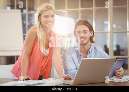 Happy business people using technologies Stock Photo - Alamy