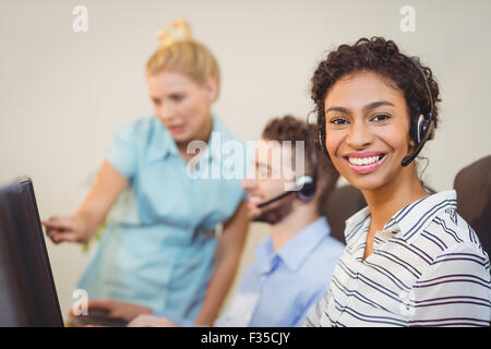 Young female employee working in the office Stock Photo - Alamy