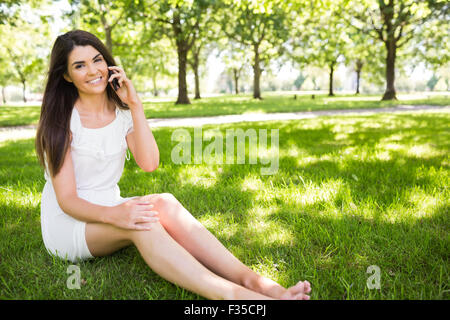 Portrait of beautiful woman talking on phone. Isolated white background ...