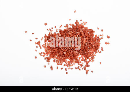 Handful of red Hawaiian sea salt isolated on white background Stock ...