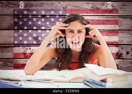 Composite image of student goes crazy doing her homework Stock Photo ...