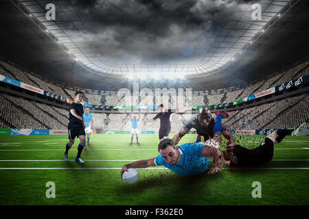 Composite image of rugby player doing a drop kick Stock Photo - Alamy