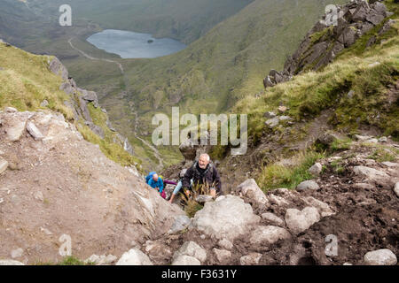 Top of Devils Ladder path from Hags Glen to Carrauntoohil with senior ...