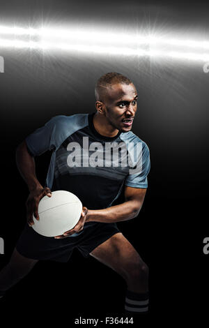 Composite image of sportsman in position to throw rugby ball Stock ...