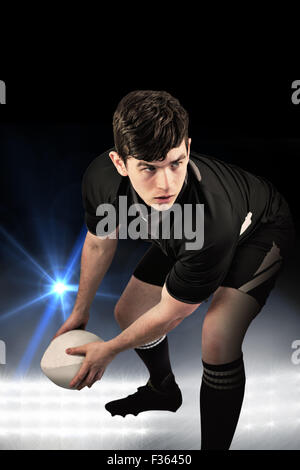 Composite image of rugby player about to throw a rugby ball Stock Photo ...