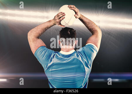 Composite image of rugby player throwing ball Stock Photo - Alamy