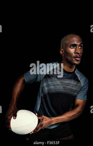 Composite image of athlete in position of throwing rugby ball Stock ...