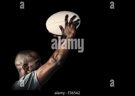 Composite image of athlete throwing rugby ball Stock Photo - Alamy