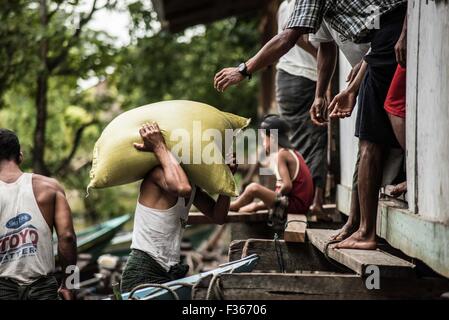 Humanitarian aid supplies are delivered by an NGO to flood hit ...