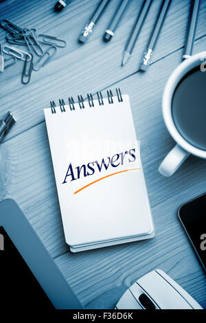 ANSWERS, on the tablet pc screen held by businessman hands - online ...